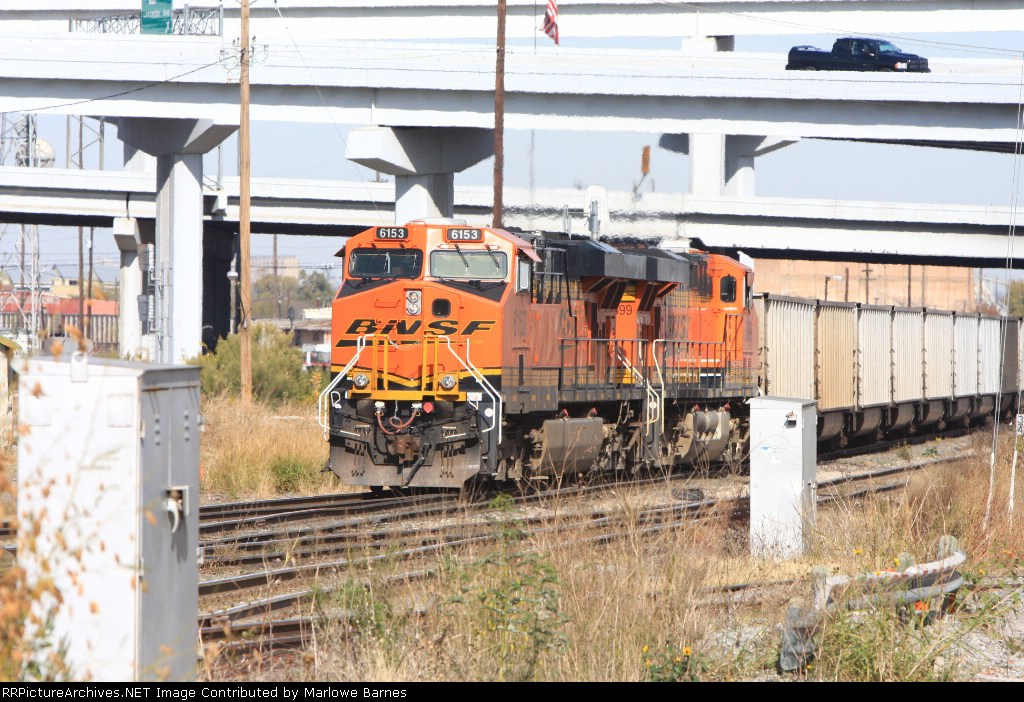 BNSF 6153 and 5899 are about to cross the diamonds at Twr 55